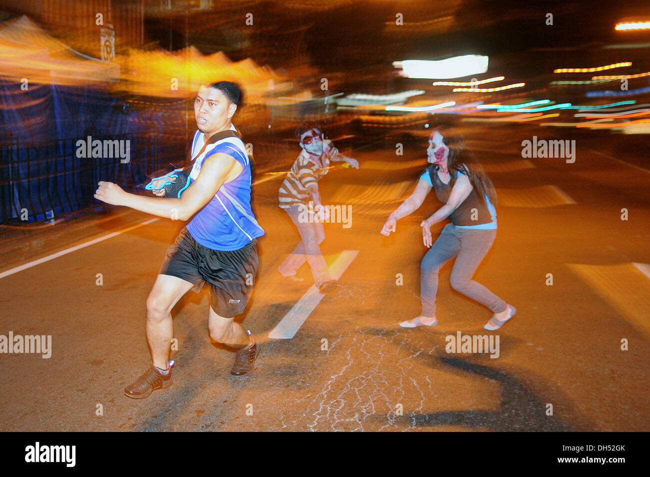 Manila, Philippines. 31st Oct, 2013. Filipino 'zombies' go after a ...