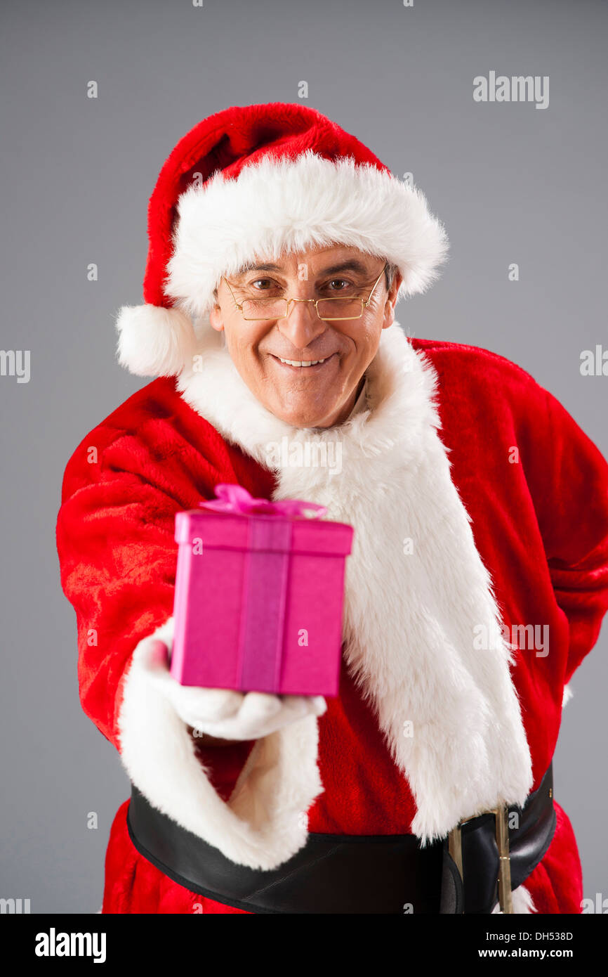 Man dressed santa claus giving hi-res stock photography and images - Alamy