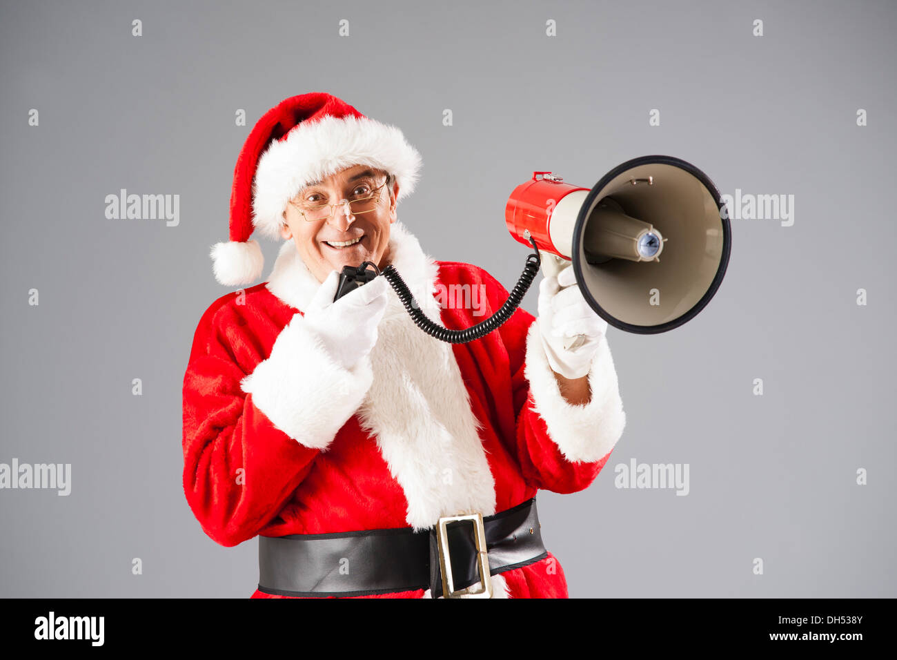 Santa shouting into a megaphone Stock Photo - Alamy