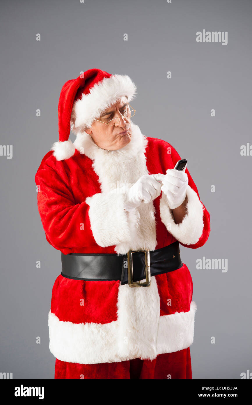 Santa Claus with mobile phone Stock Photo - Alamy