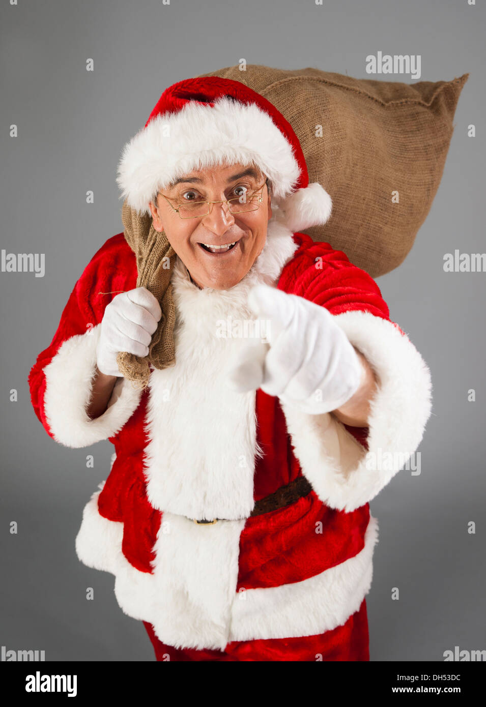 Santa Claus holding a sack Stock Photo - Alamy
