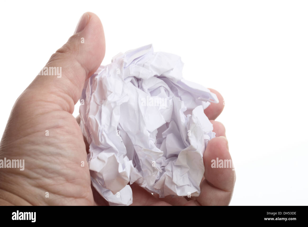 Close up of male hand holding crumpled paper isolated over a white ...