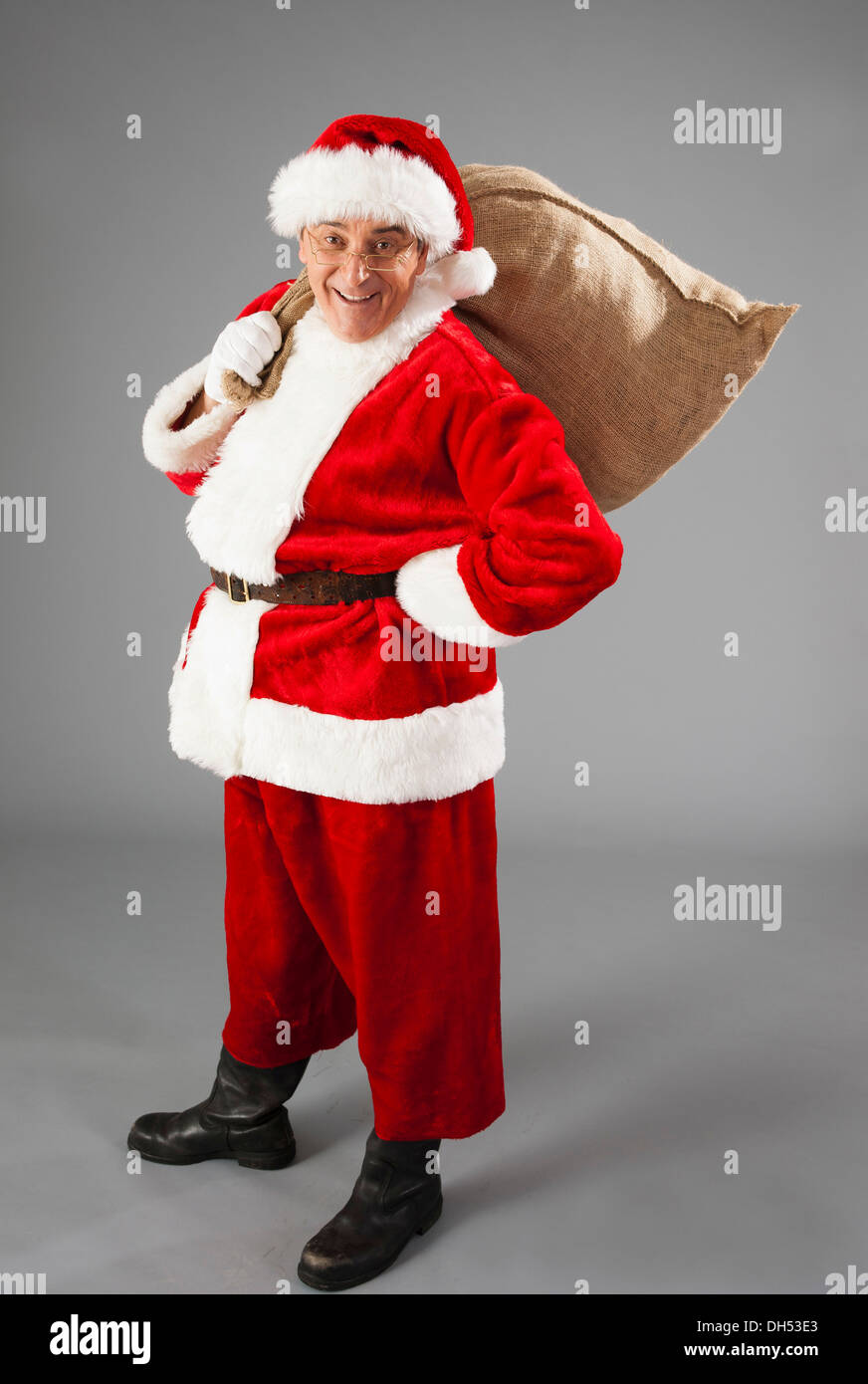 Santa Claus holding a sack Stock Photo - Alamy