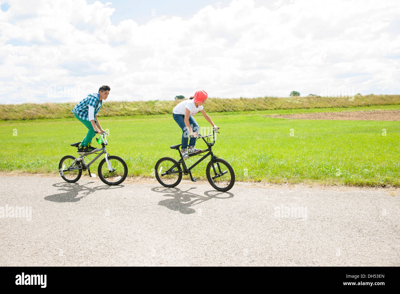 Two boys cycling Stock Photo - Alamy
