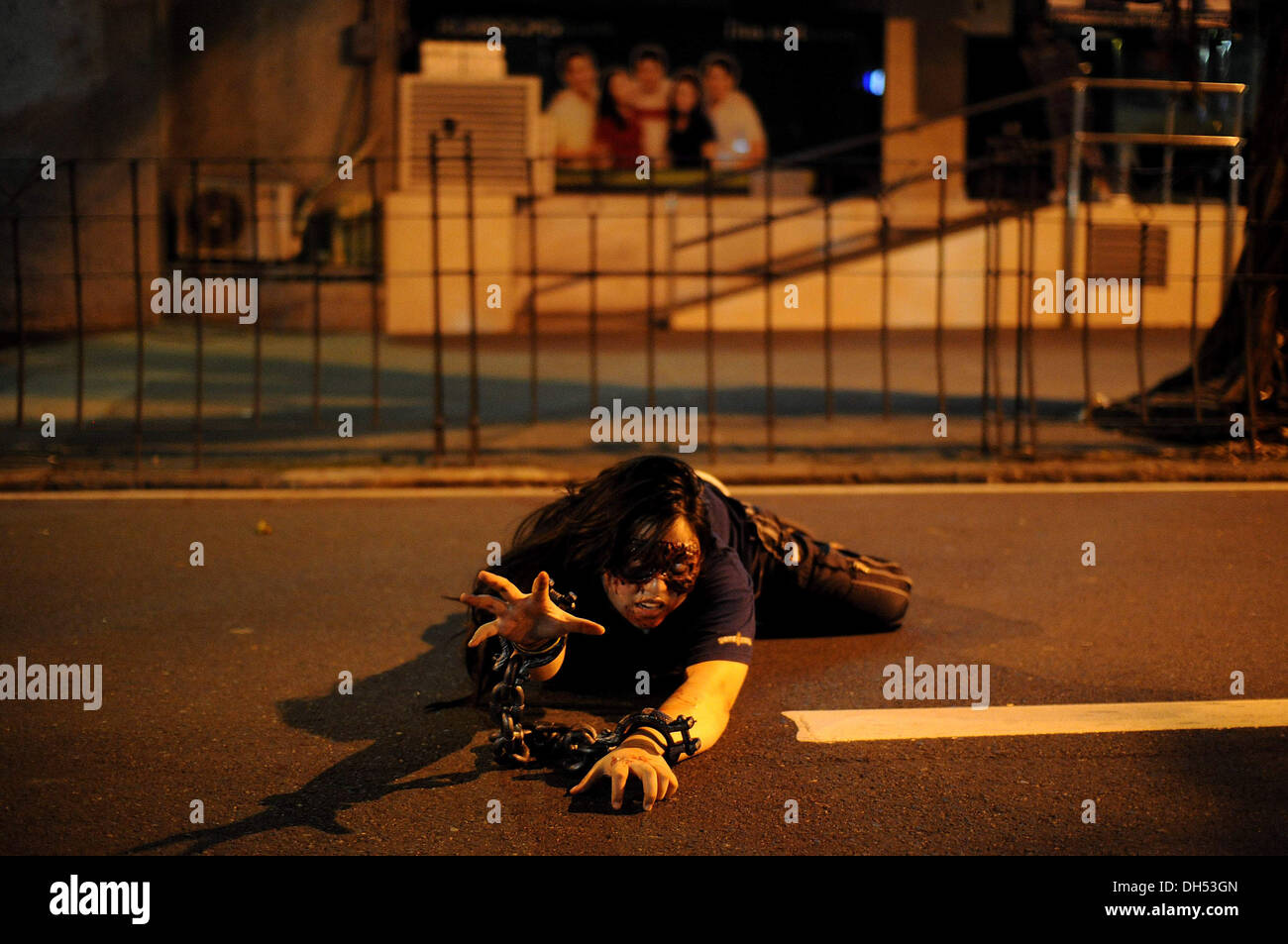Manila, Philippines. 31st Oct, 2013. A Filipino 'zombie' lies on the ...