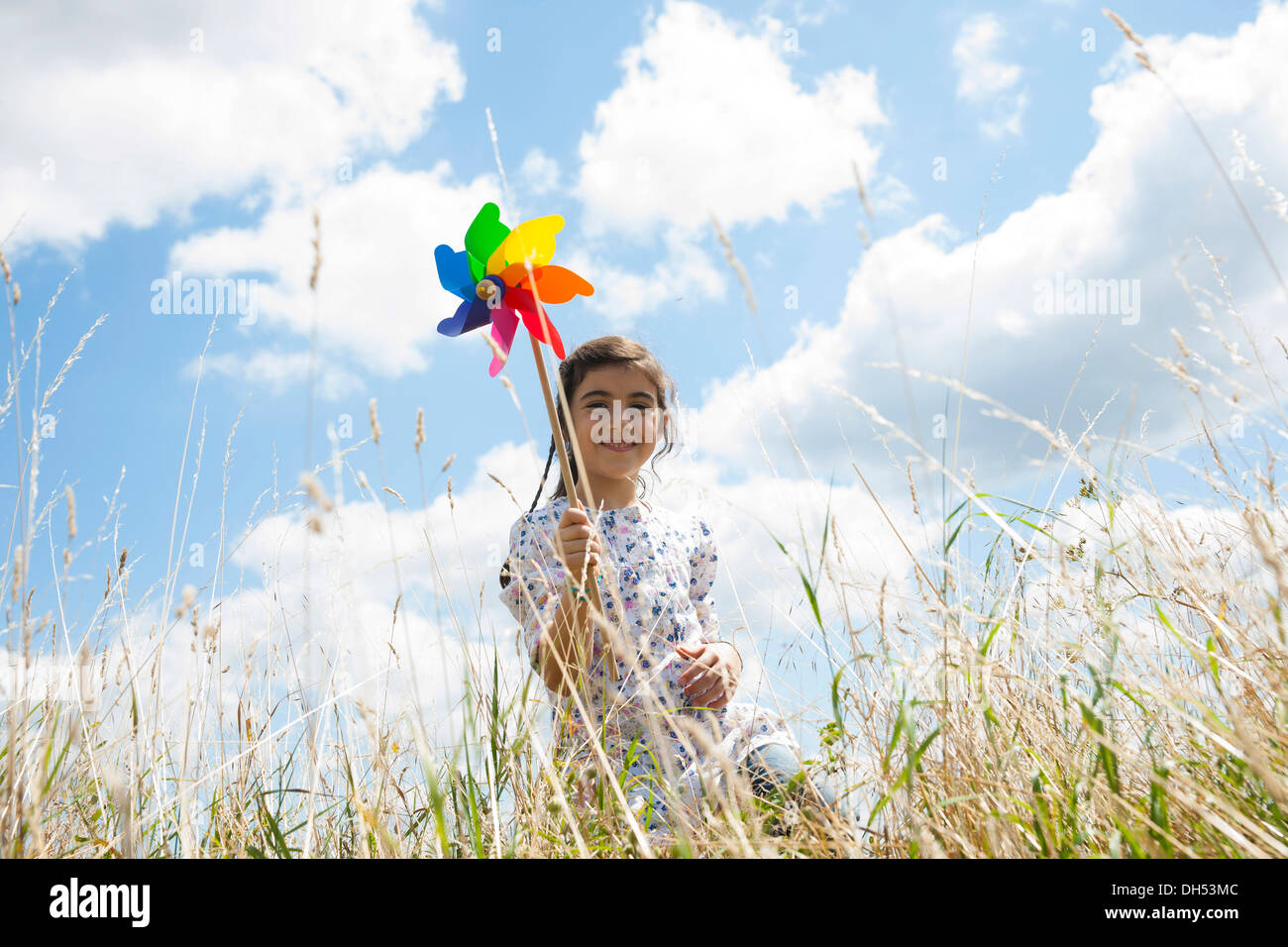 Girl with a pinwheel hi-res stock photography and images - Alamy