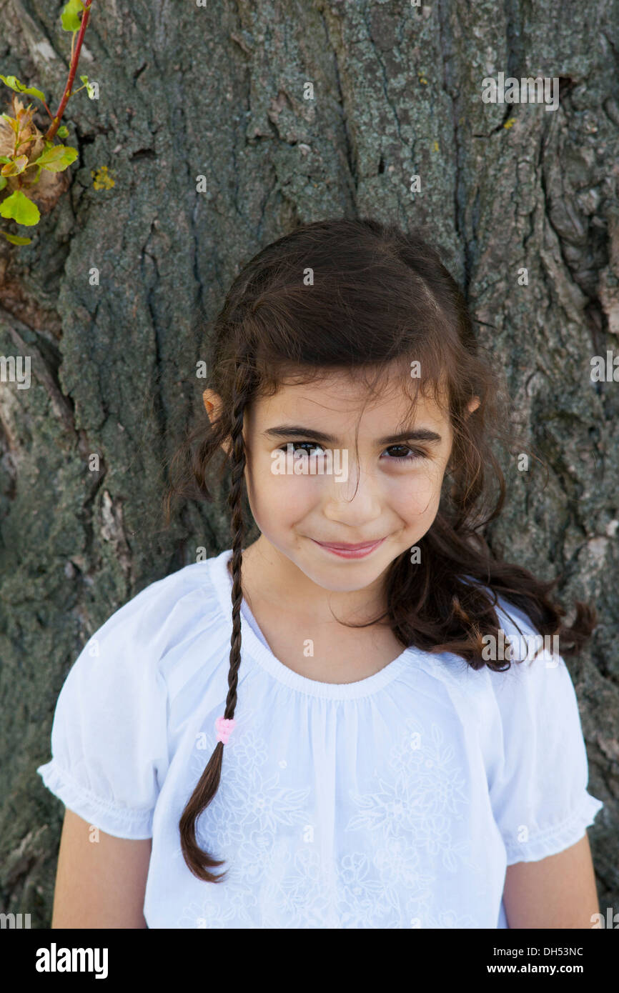 Girl at a tree, portrait Stock Photo - Alamy