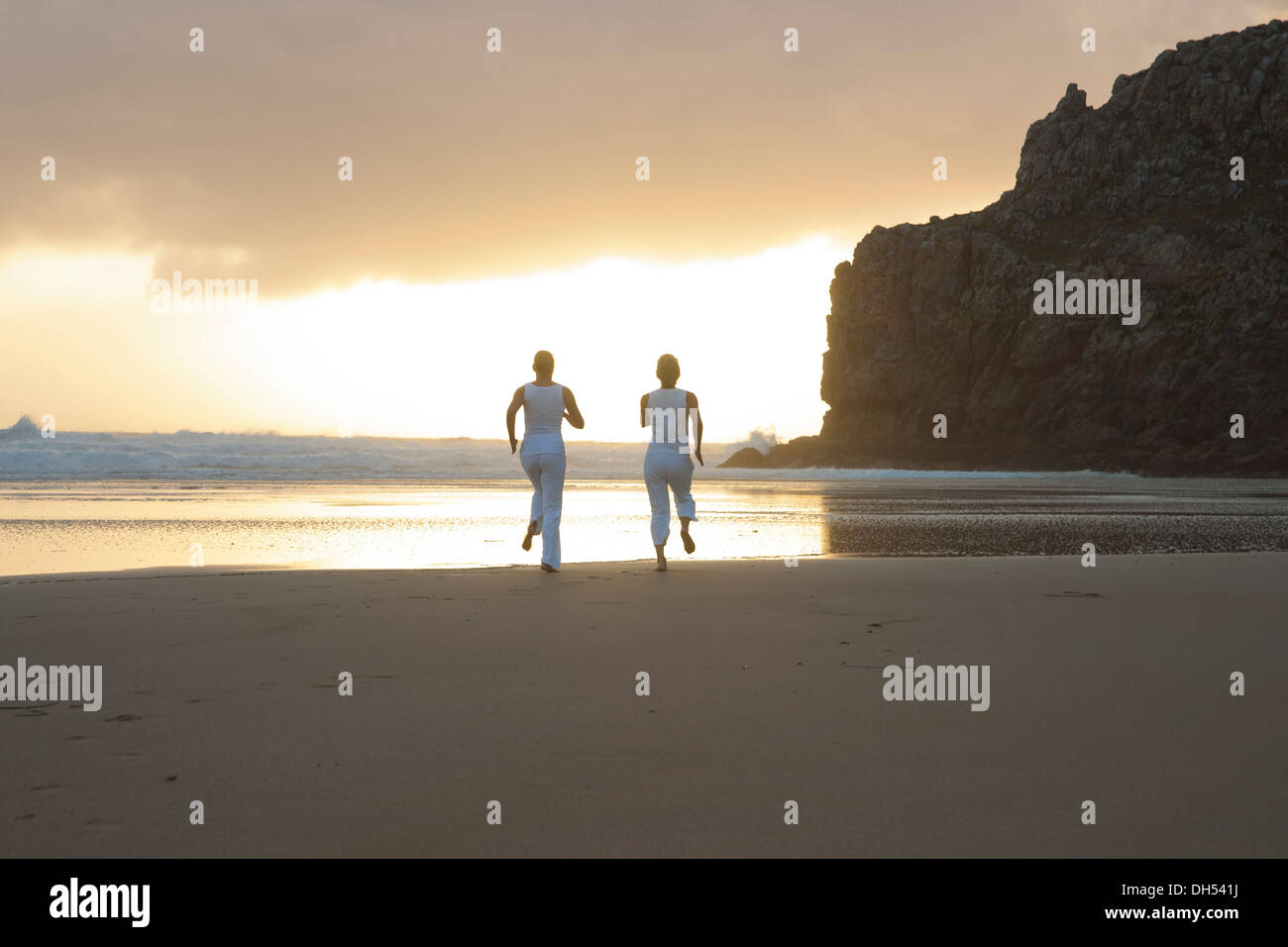 Two women sunset rear view hi-res stock photography and images - Alamy