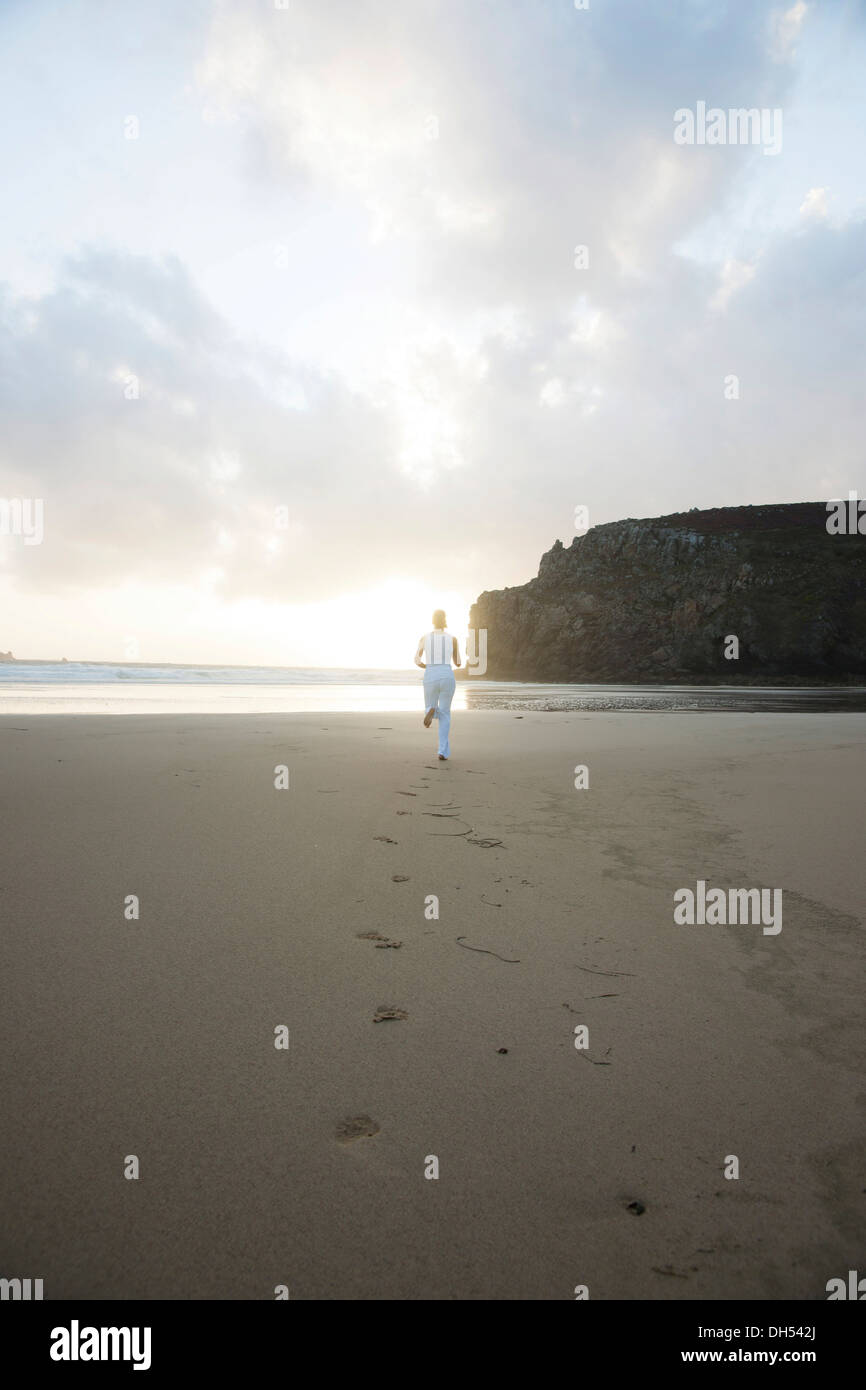 Female running beach alone activity hi-res stock photography and images ...