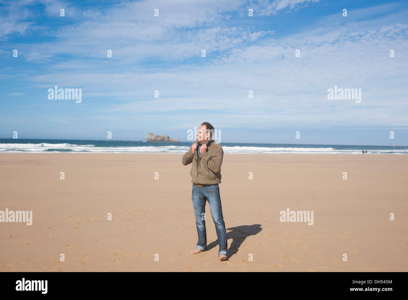 Man walking along the beach hi-res stock photography and images - Alamy