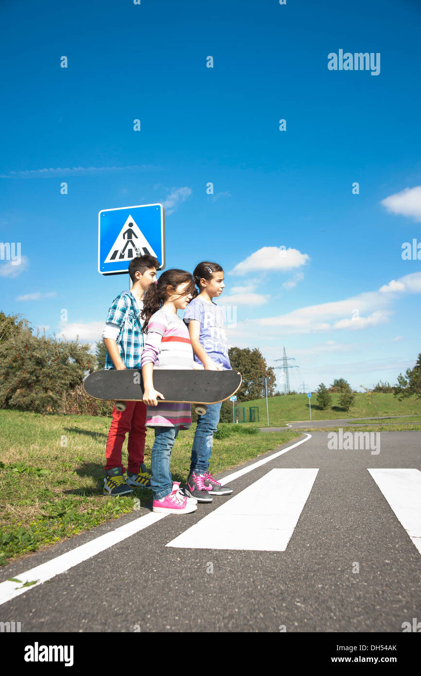 Children crossing a zebra crossing Stock Photo - Alamy