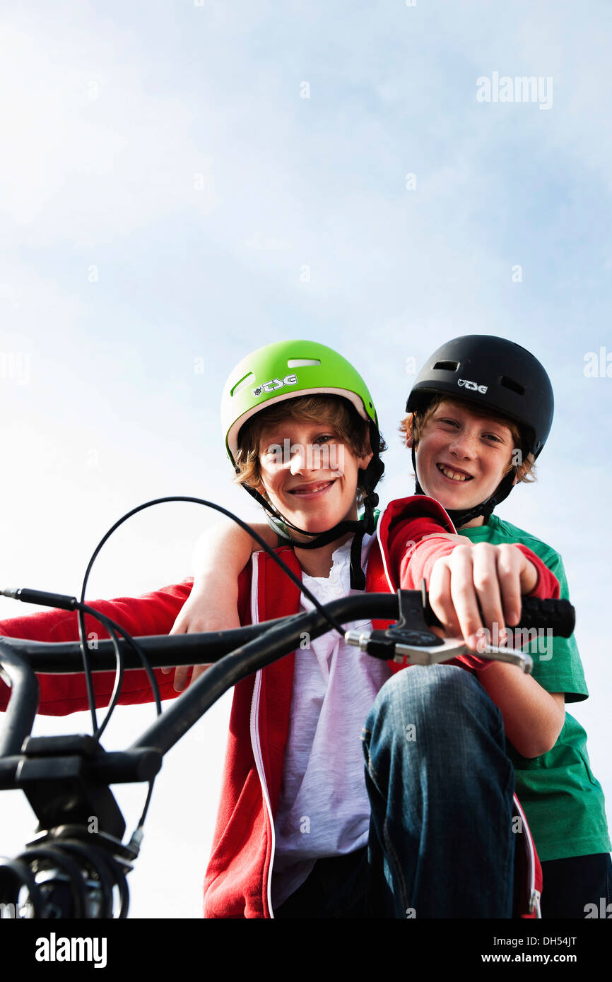 Two cool boys on a BMX bike Stock Photo - Alamy