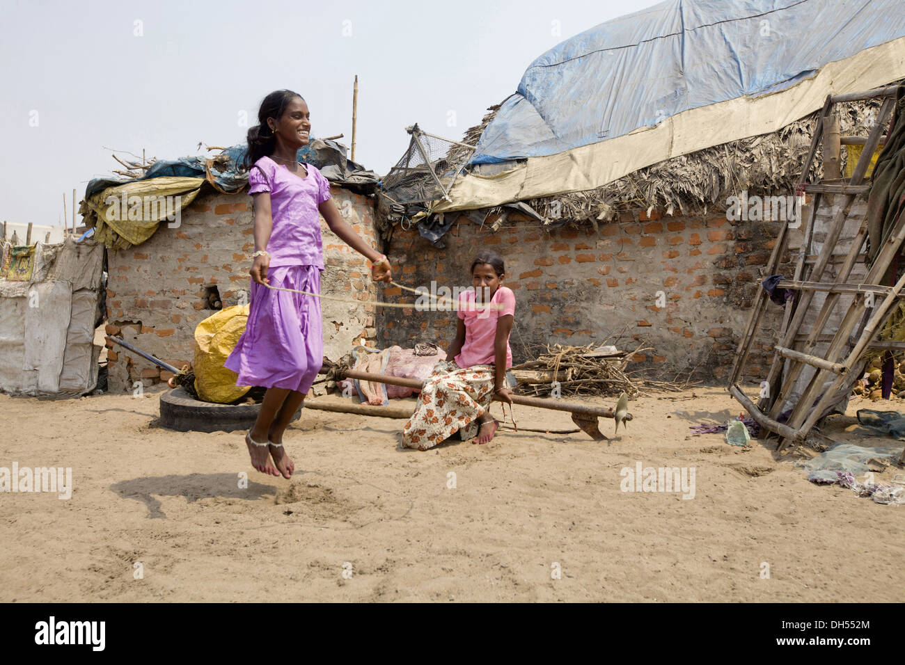 Tribal girl playing skipping rope, Orissa, India Stock Photo - Alamy