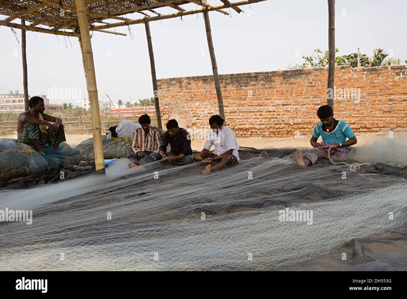 Fishermen making fishing nets, Orissa, India Stock Photo - Alamy