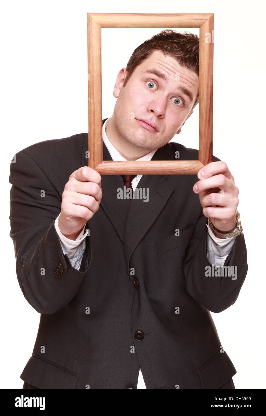 Humorous business man getting his head out of empty frame desperate ...