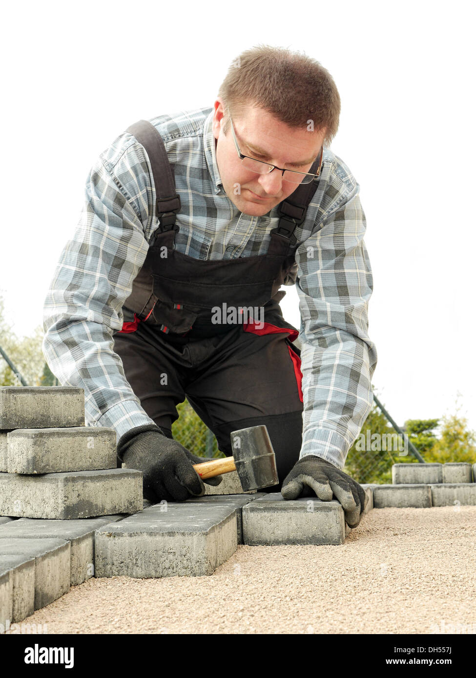Paver laying driveway pavement out of concrete pavement blocks Stock ...