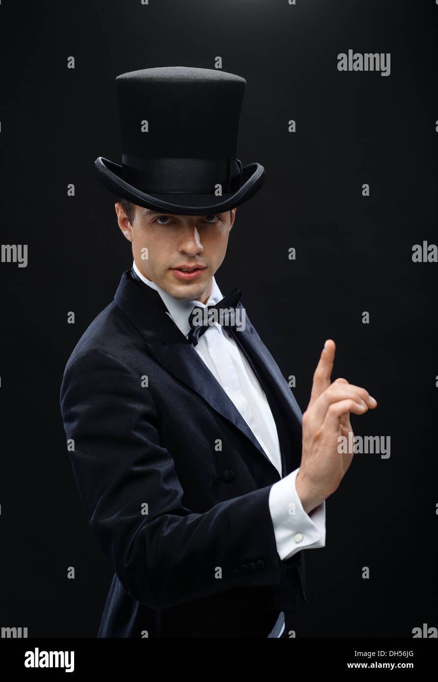 magician in top hat showing trick Stock Photo - Alamy