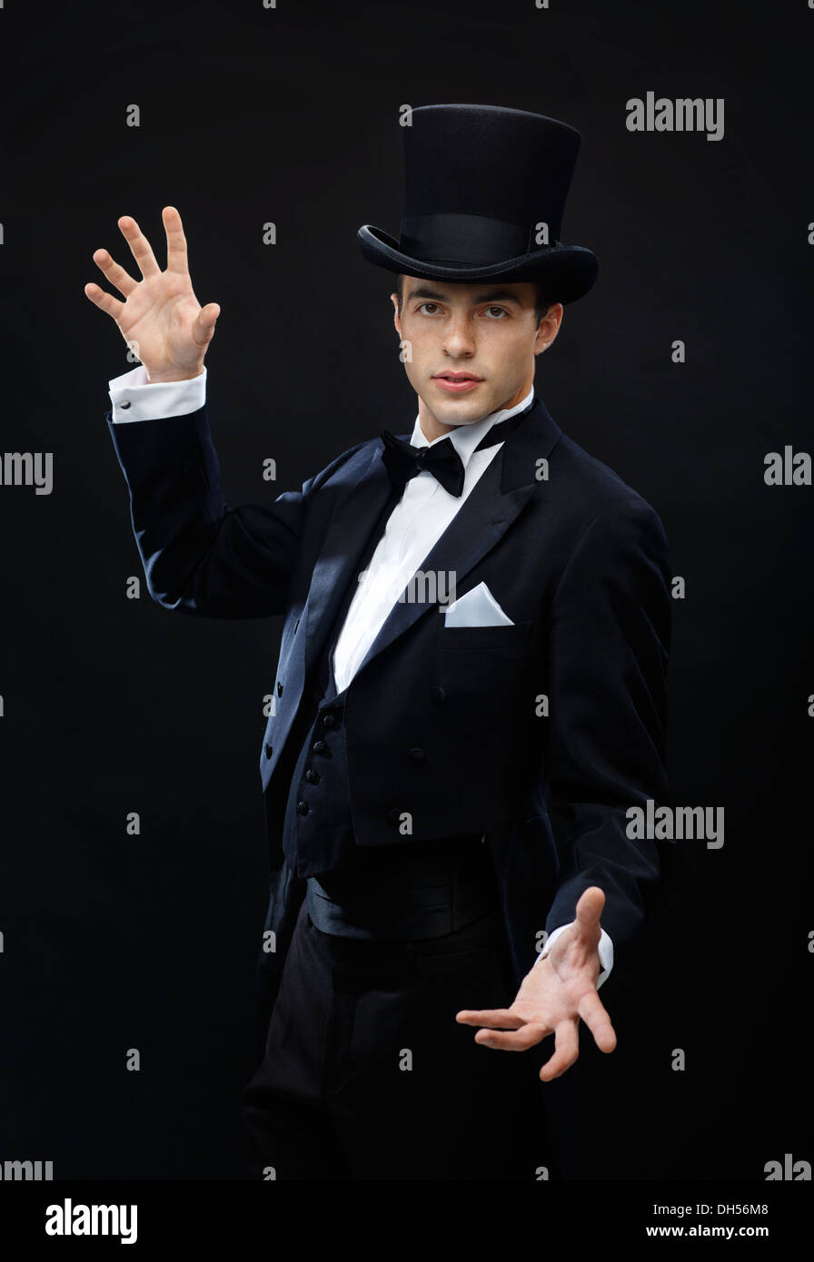 magician in top hat showing trick Stock Photo - Alamy