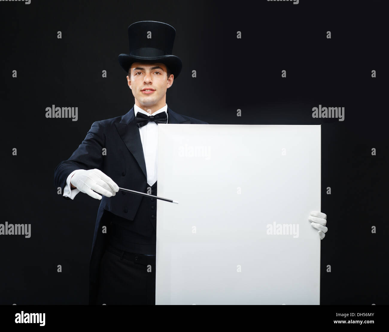magician in top hat with magic wand showing trick Stock Photo - Alamy