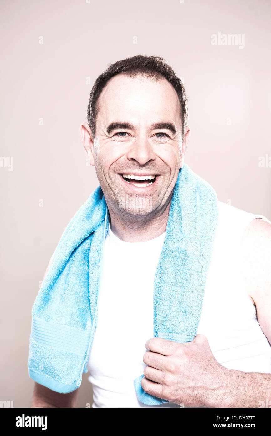 Man with a towel hi-res stock photography and images - Alamy