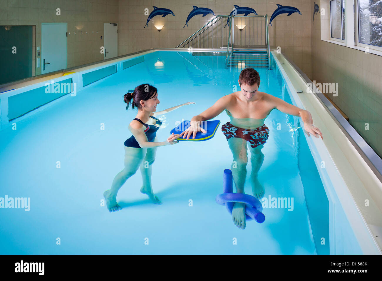 Patient and physiotherapist during underwater therapy Stock Photo - Alamy