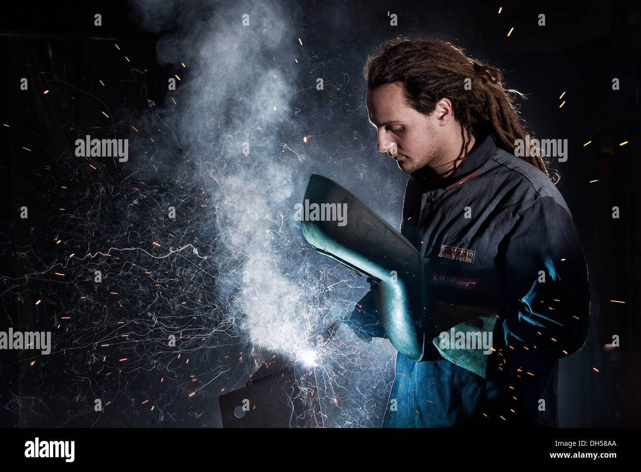 Welder welding with protective equipment, Kundl, Kufstein District ...