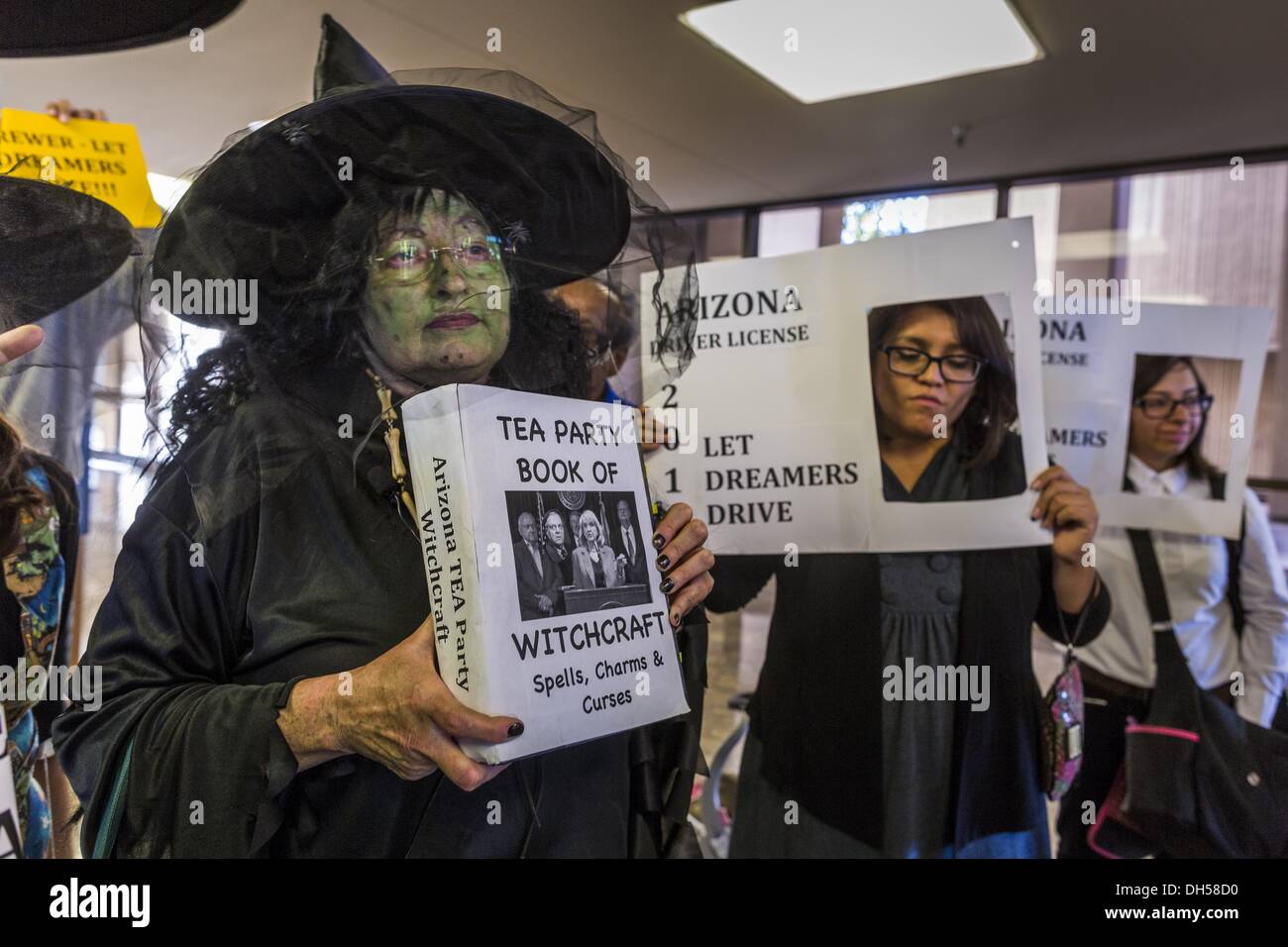 Phoenix, AZ, USA. 31st Oct, 2013. An immigration protester dressed as a ...