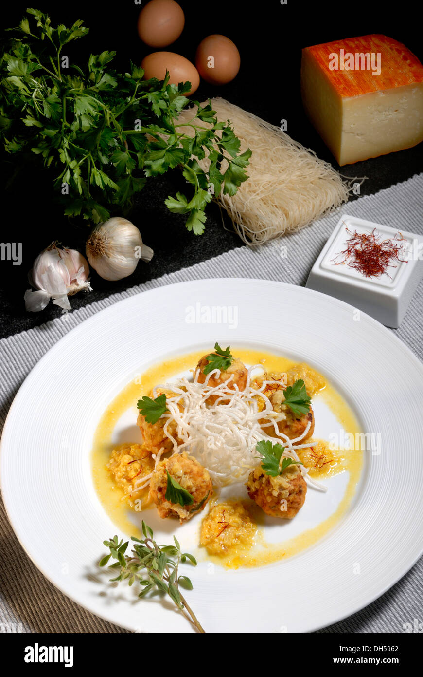 Calamari dumplings with rice spaghetti Stock Photo - Alamy