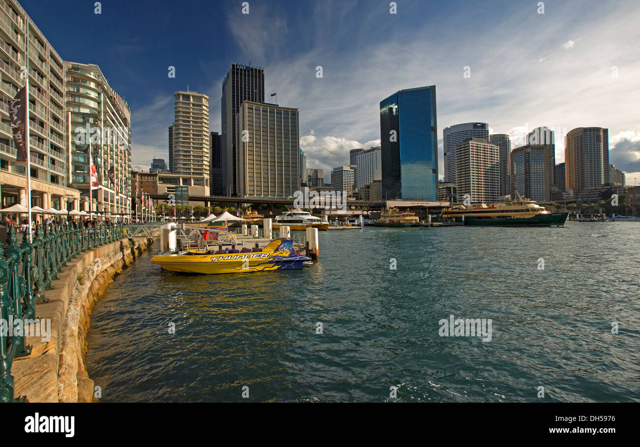 Waterfront city skyscrapers and commuter ferry beside Circular Quay at ...