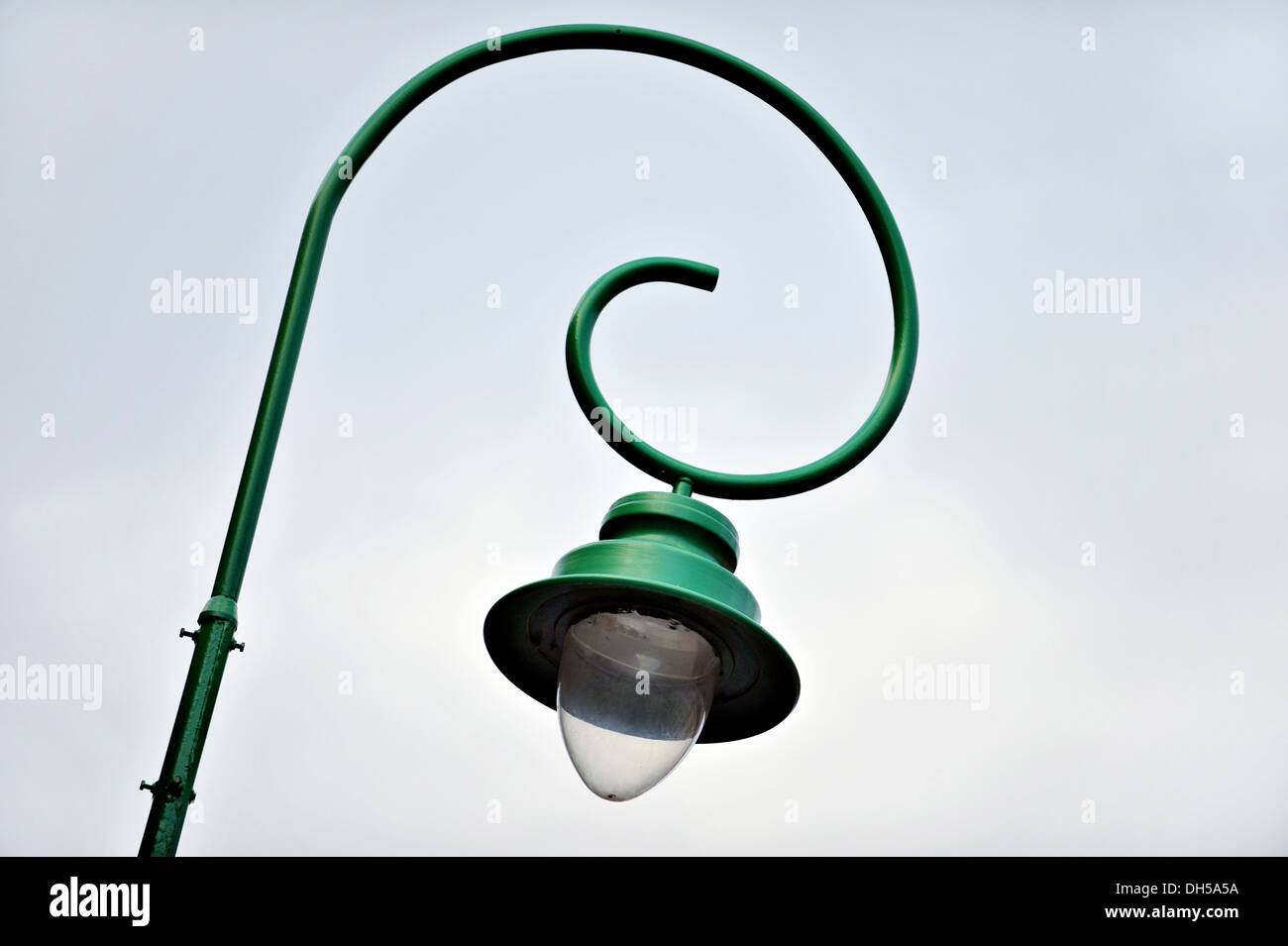 Outdoor green lighting pole shot against clear sky Stock Photo - Alamy