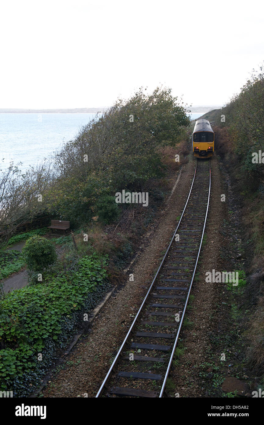A train leaves st. ives station in cornwall and travels along the coast ...