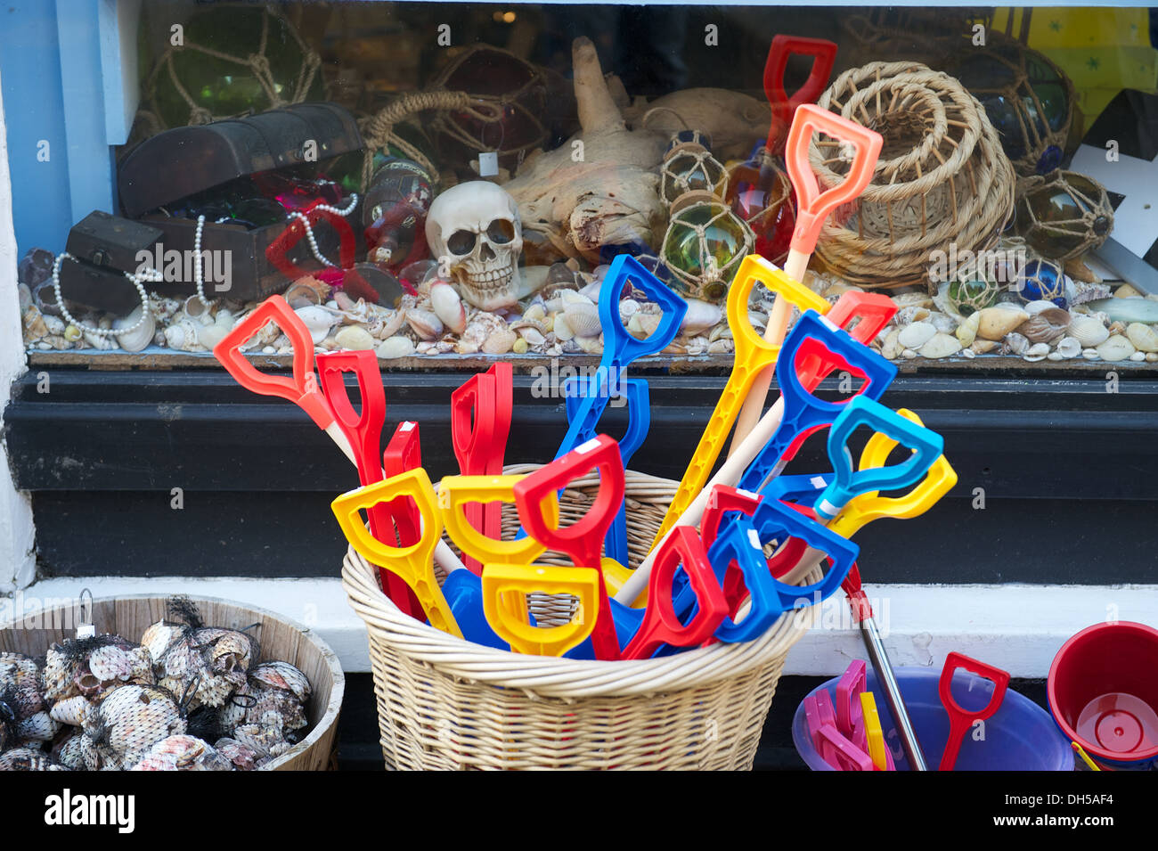 Coloured spades for sale at the seaside Stock Photo - Alamy