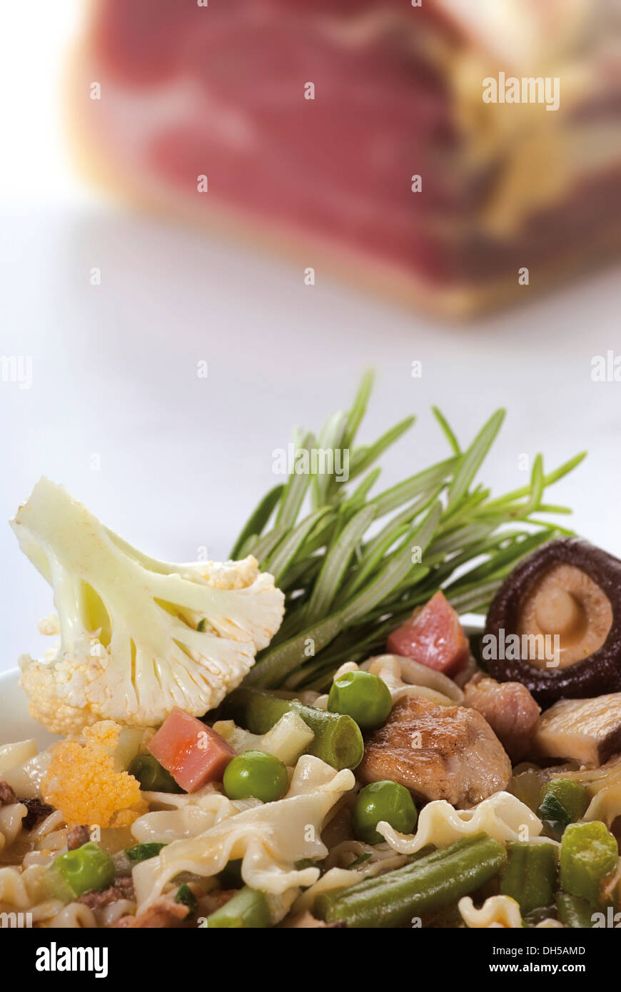 Rabbit with pasta and vegetables Stock Photo - Alamy