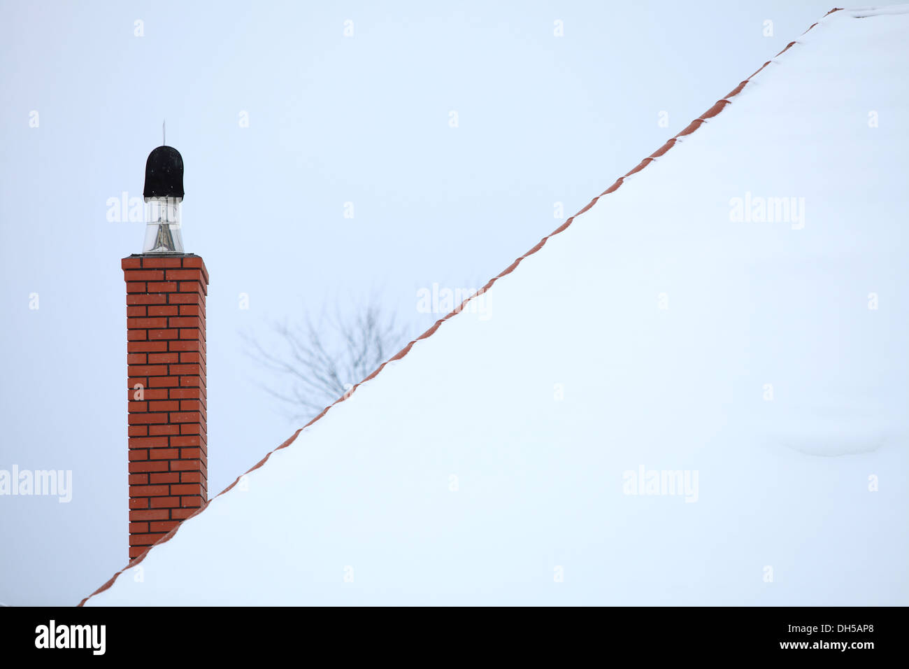 Red chimney on the snow covered roof Stock Photo - Alamy
