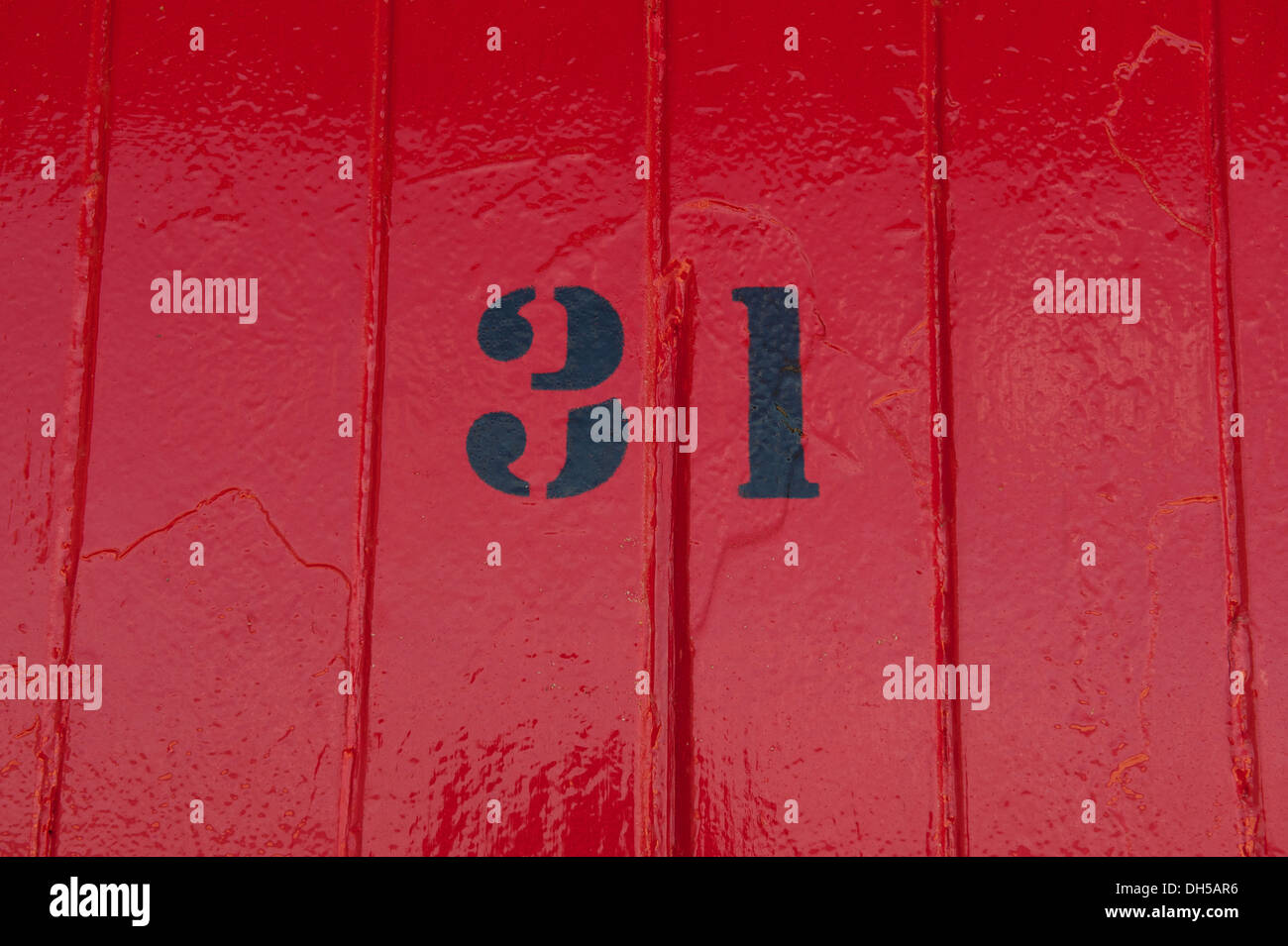 Red beach hut door with number 31 35 Stock Photo - Alamy