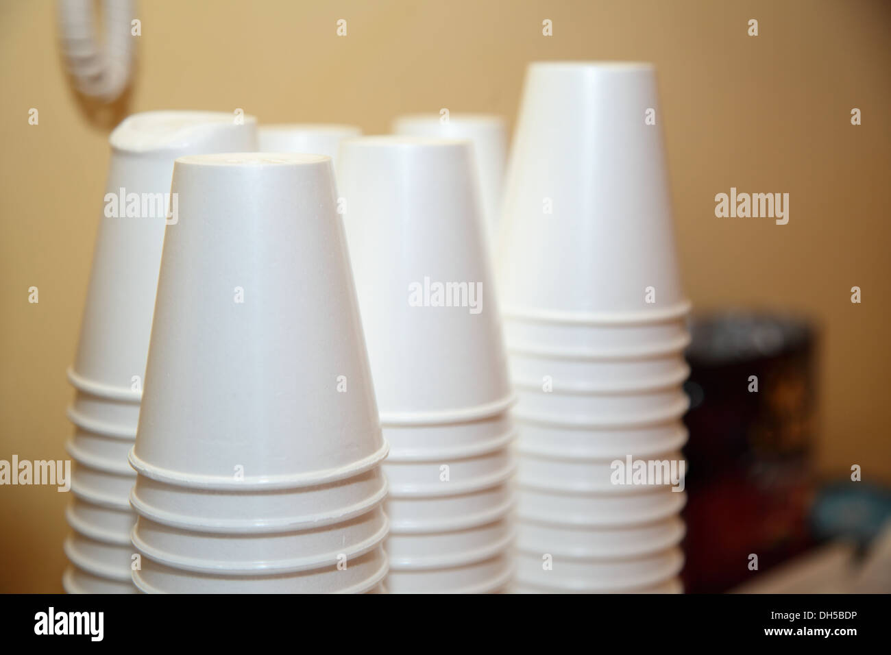 Disposable plastic kitchen utensils pile stack cups on table Stock ...