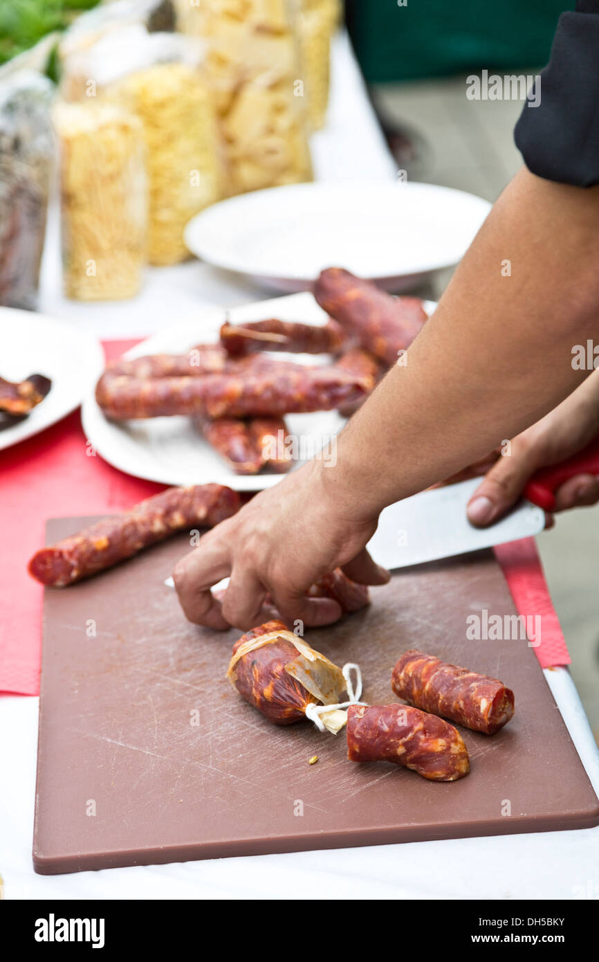 Man cutting salami at Italian Festival 21 Sept 2013, Peterborough ...