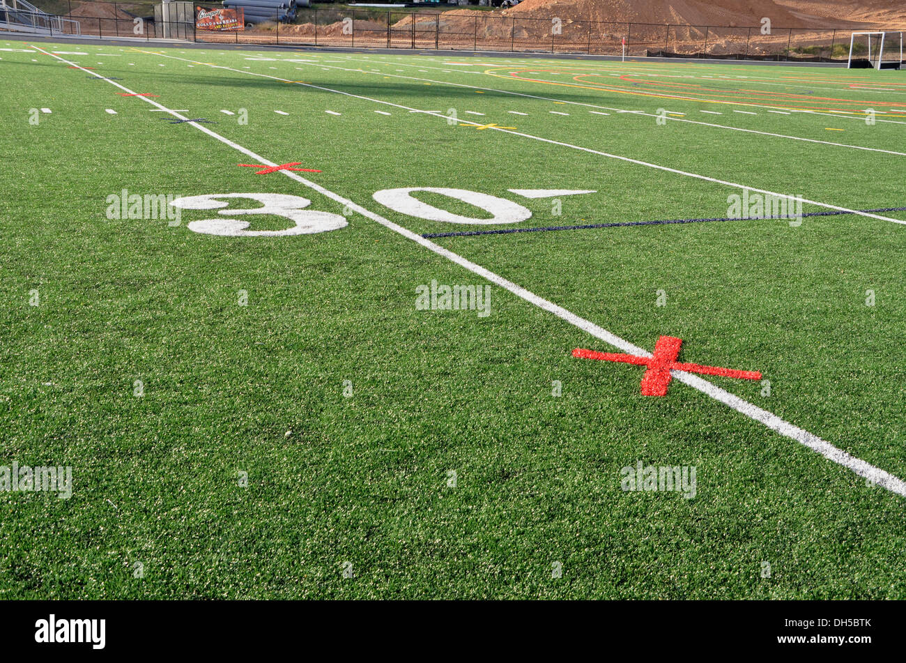 X marks the spot on a football field Stock Photo - Alamy