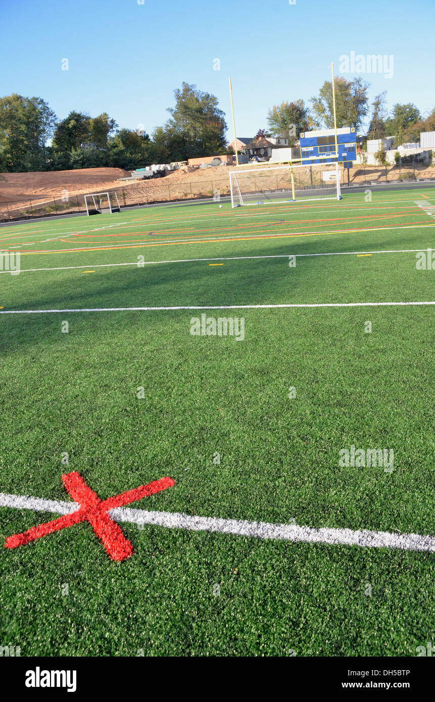 X marks a spot on a football field Stock Photo - Alamy