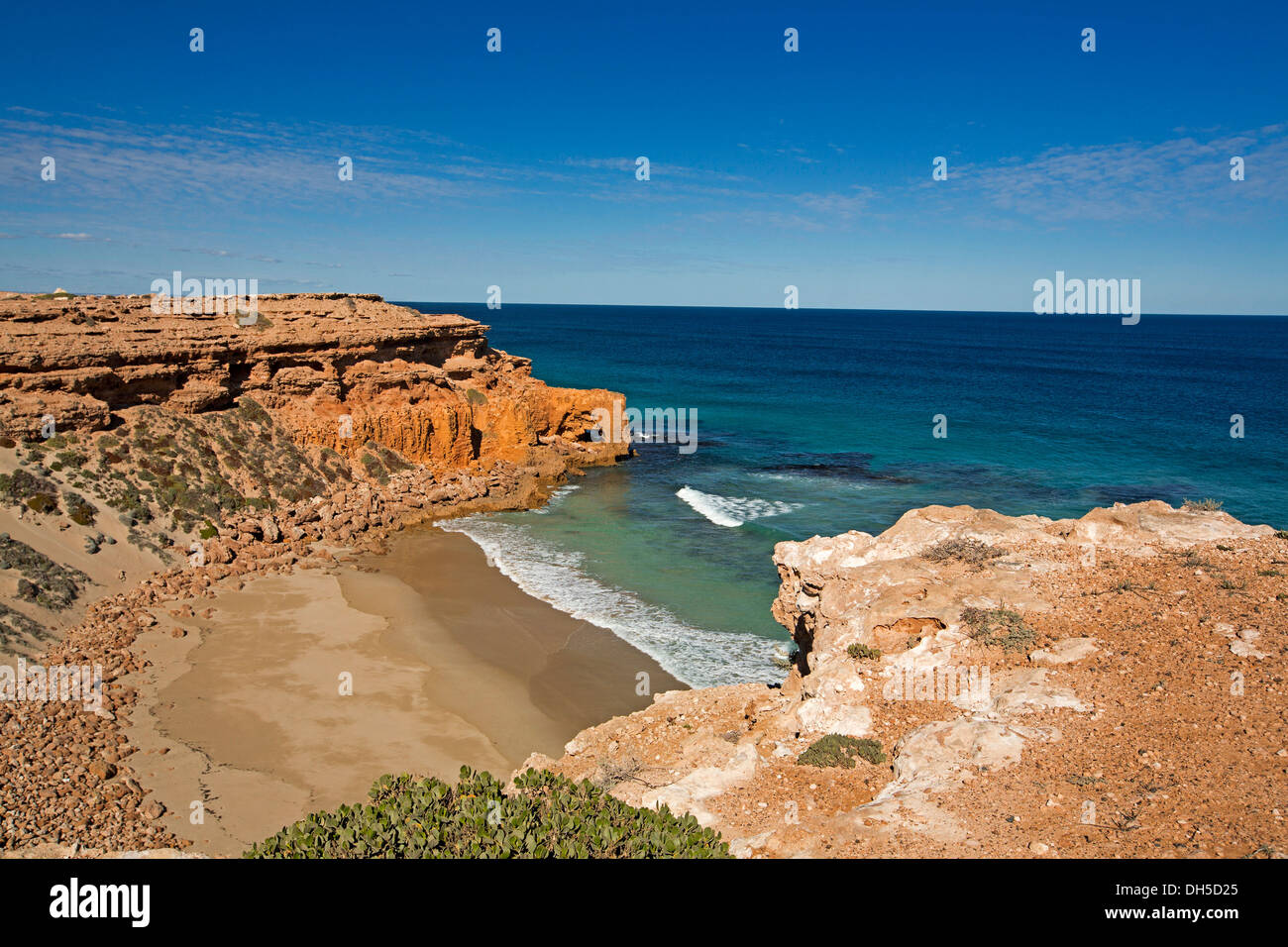 Coastal landscape, cliffs and beach in secluded bay from Needle Eye ...