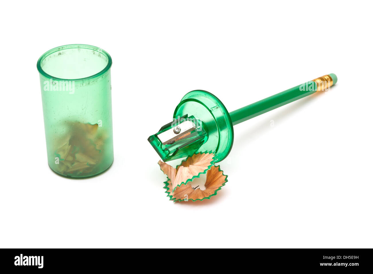 Green sharpener and pencil on white background Stock Photo - Alamy