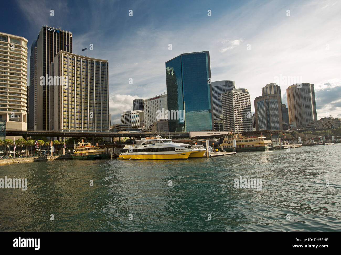 Waterfront city skyscrapers and commuter ferry beside Circular Quay at ...