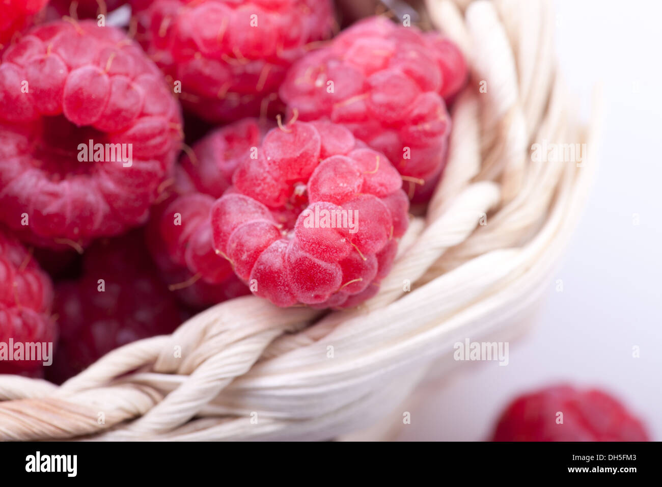 close up raspberries in the basket Stock Photo - Alamy
