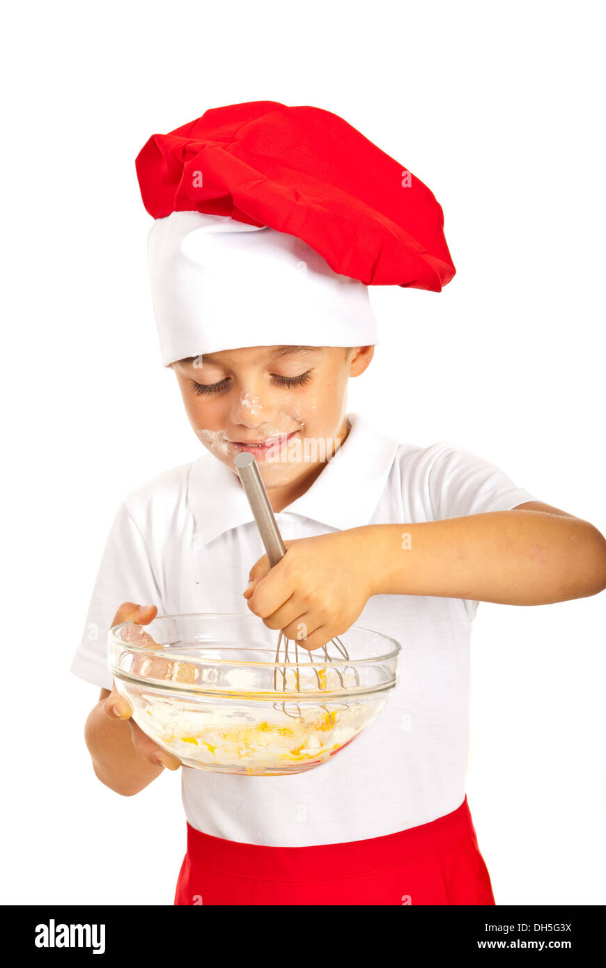 Smiling chef boy mixing dough isolated on white background Stock Photo ...