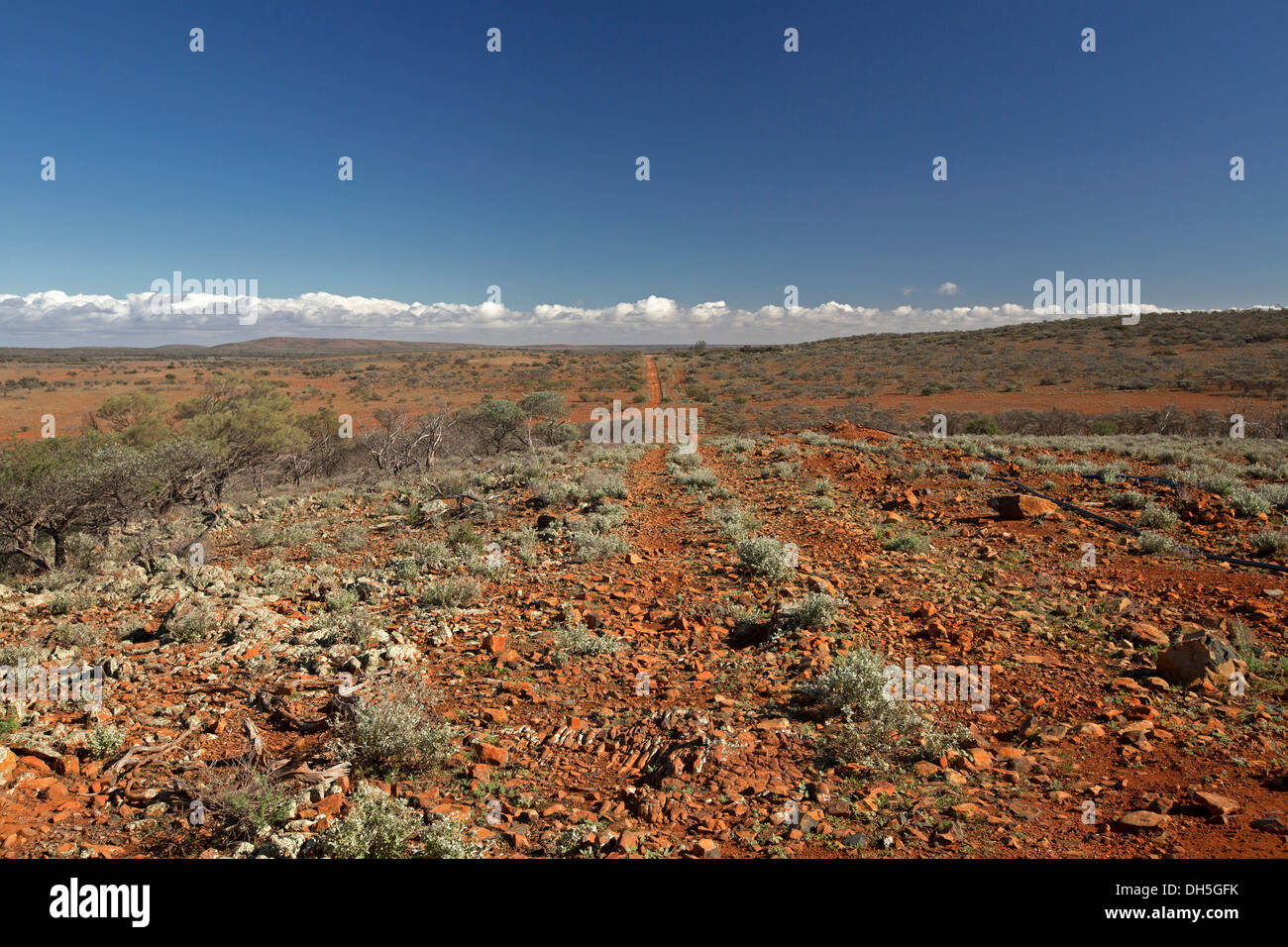 Stunning view of vast outback landscape with red road leading across ...
