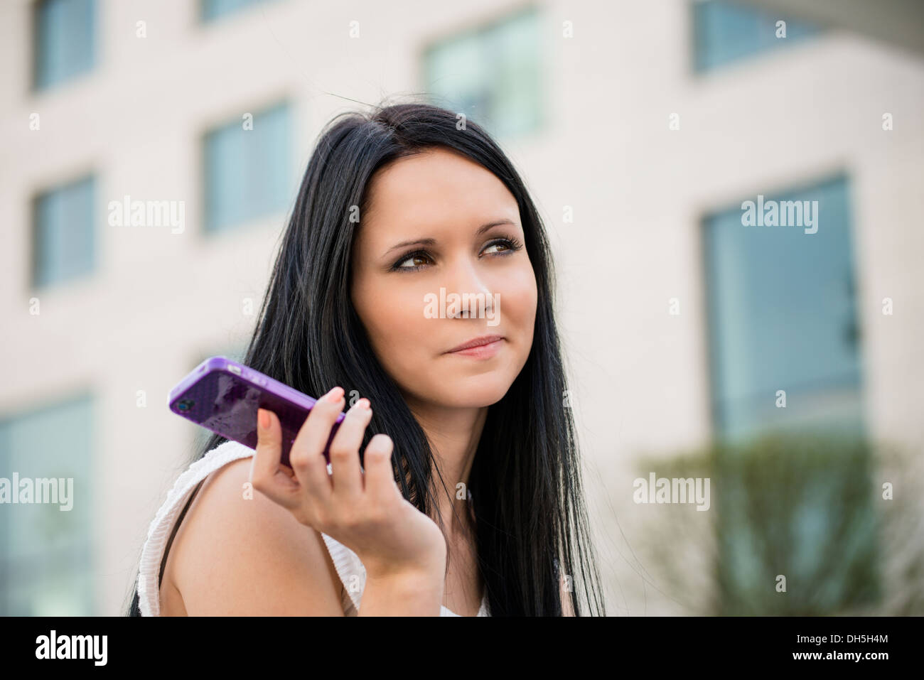 Young beautiful woman with mobile phone bored from call Stock Photo - Alamy