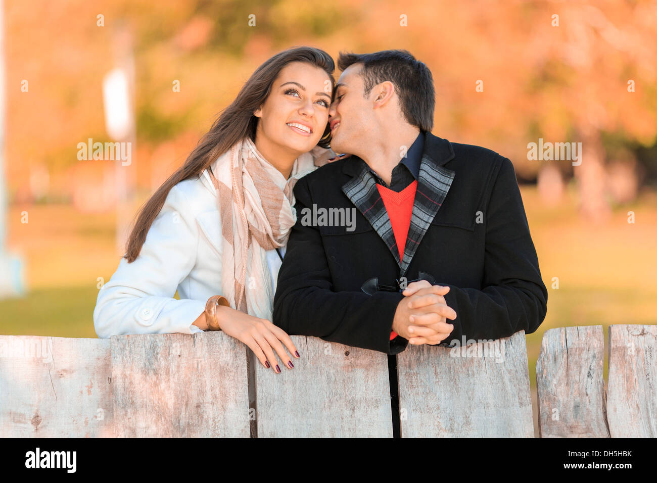 Young couple by the fence Stock Photo - Alamy