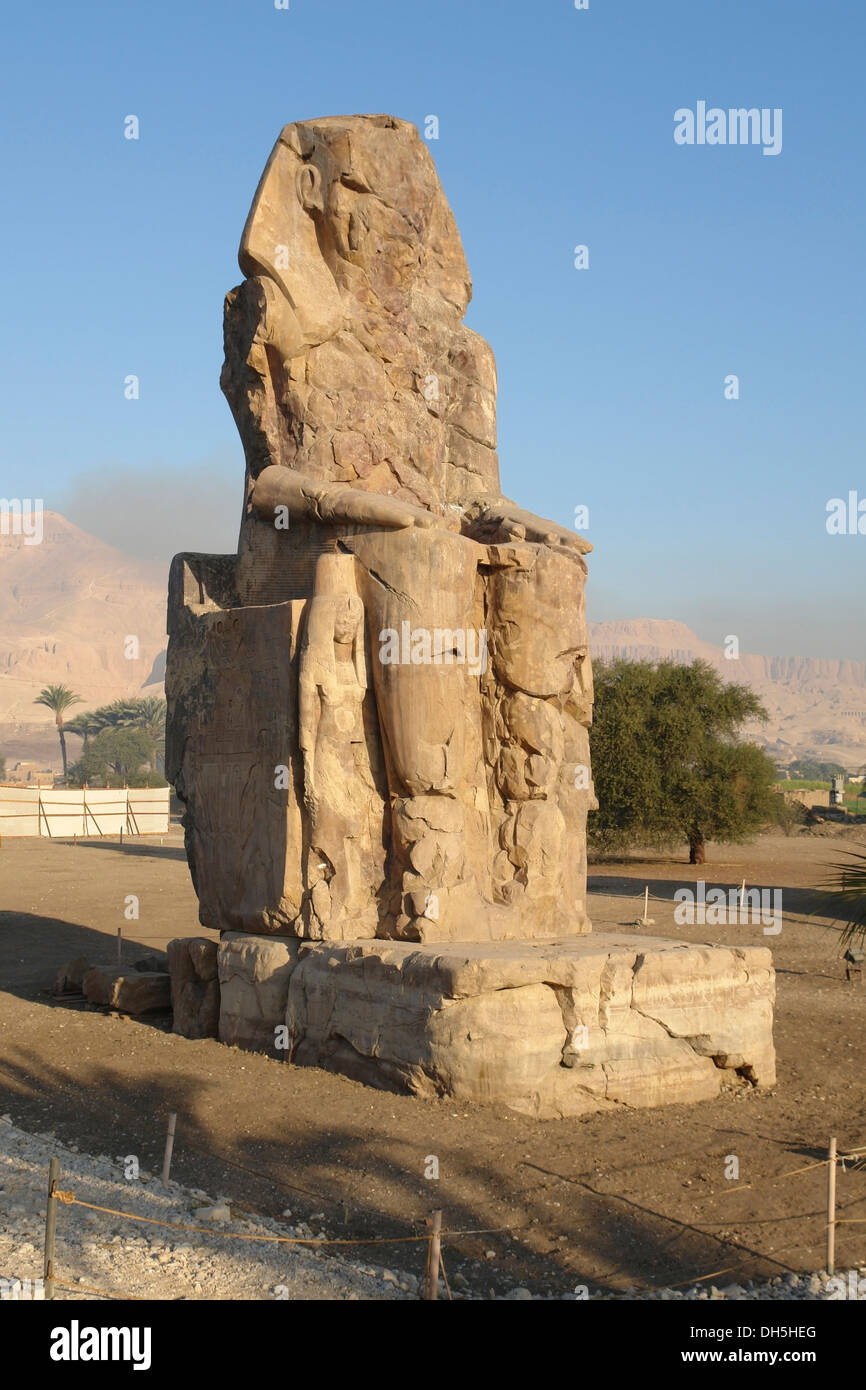 southern one of the Colossi of Memnon, two huge ancient statues near ...