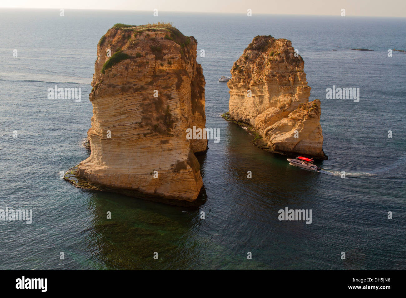 Motorboat between El Rawsheh Rock or Pigeon Rocks, Beirut, Lebanon ...