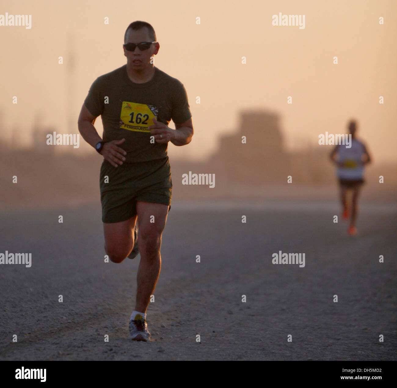 Runners compete in the 2013 Marine Corps Marathon Fowrard at Camp ...